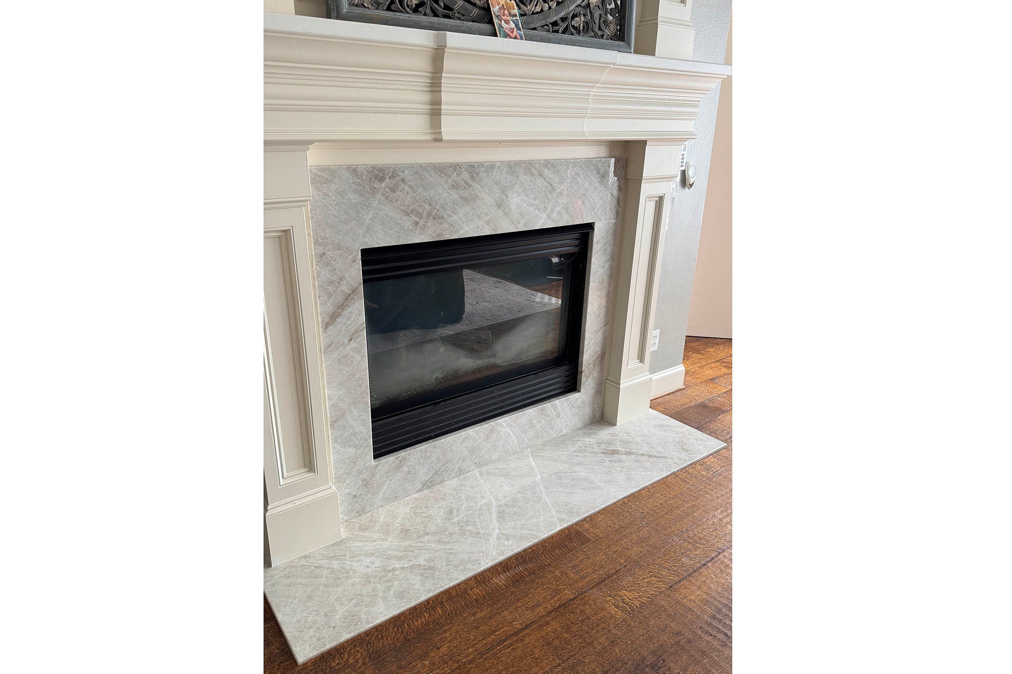 Taj Mahal Quartzite fireplace installation Project in Dallas, TX